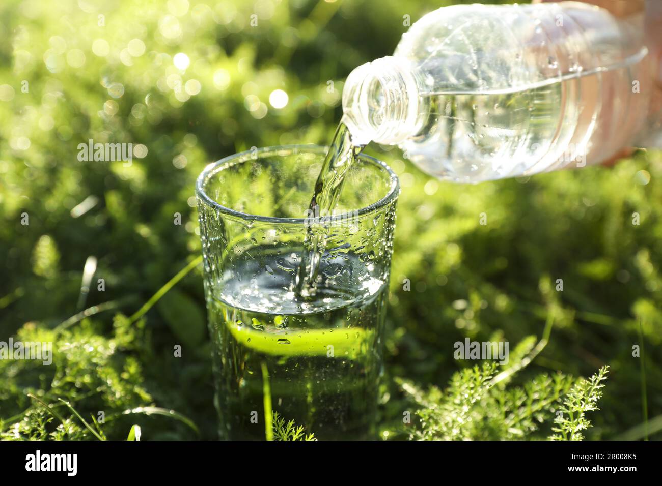 Woman pour water male hi-res stock photography and images - Alamy