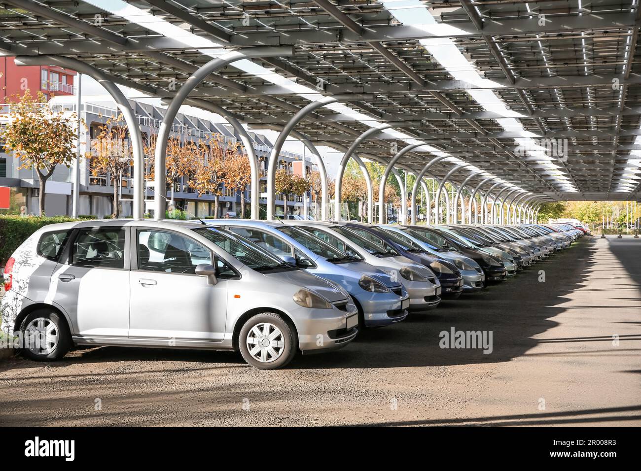 Parking lots with modern cars on city street Stock Photo - Alamy