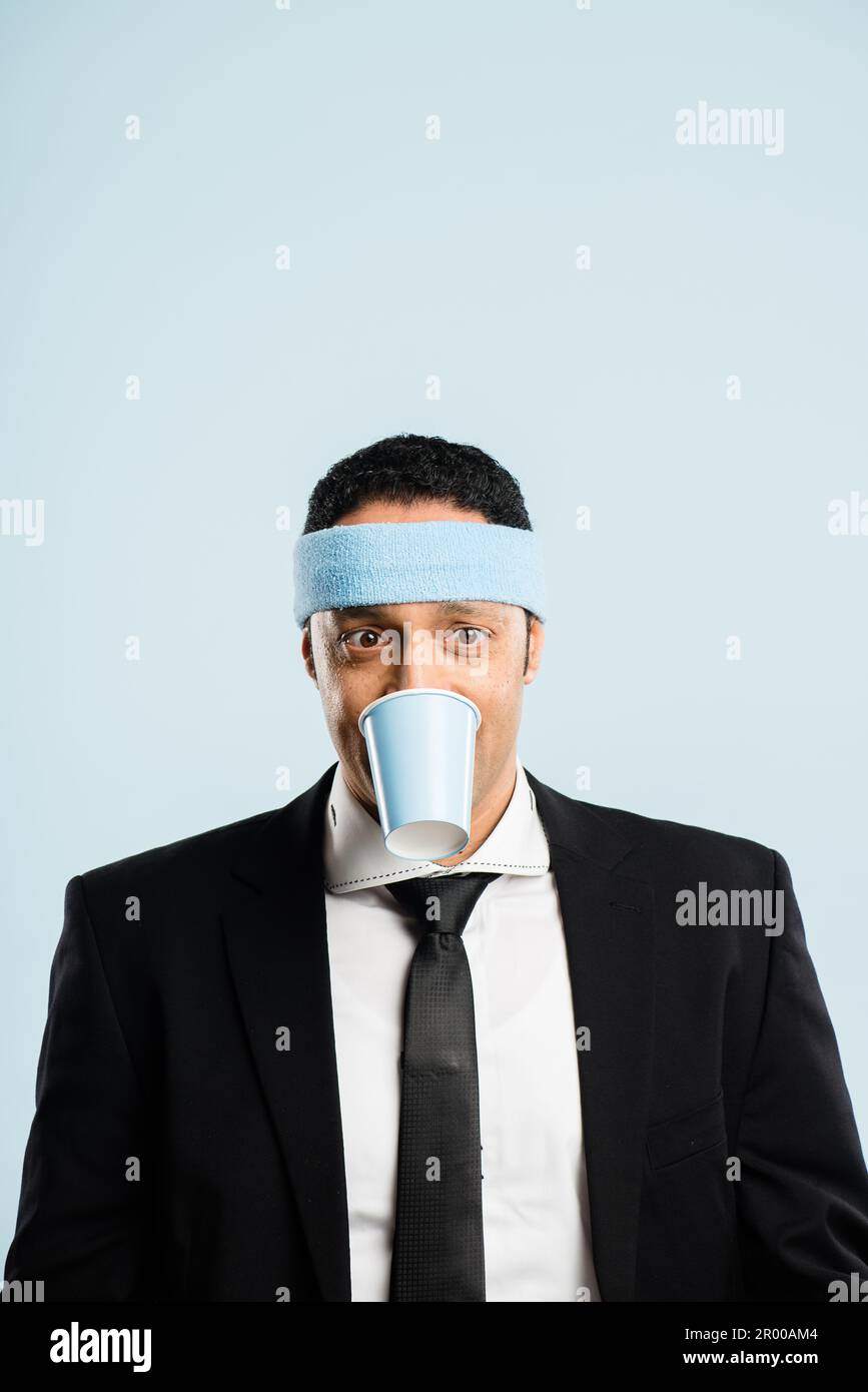 One too many coffees today. a handsome young man standing alone in the ...