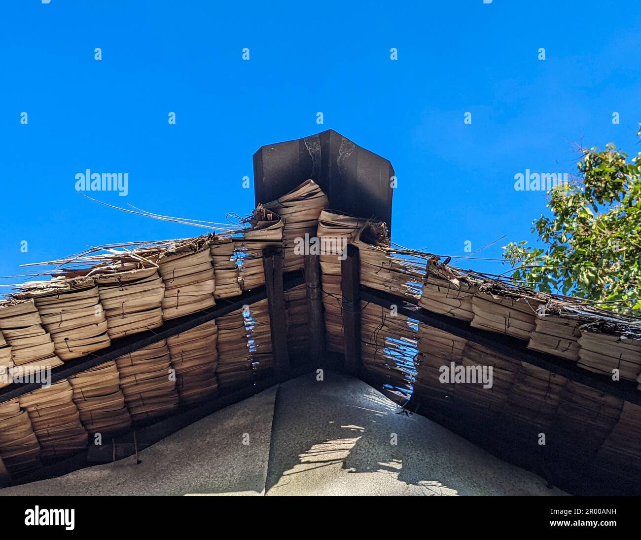 Nipa palm dried leaves and bamboo made the roof of the house to be a ...
