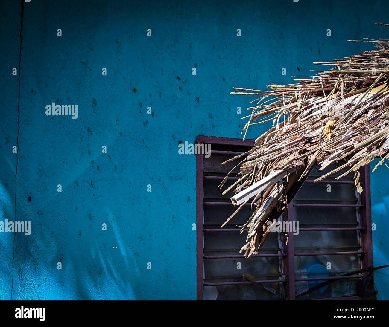 Nipa palm dried leaves and bamboo made the roof of the house to be a ...