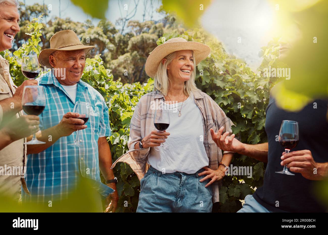 Farmer talking and explaining to diverse group of friends while holding ...