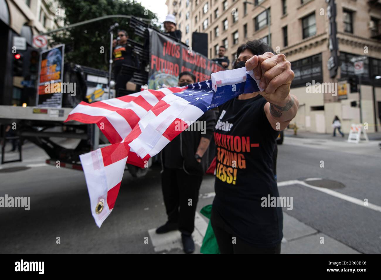 Los Angeles, United States. 01st May, 2023. A protester rips apart an ...