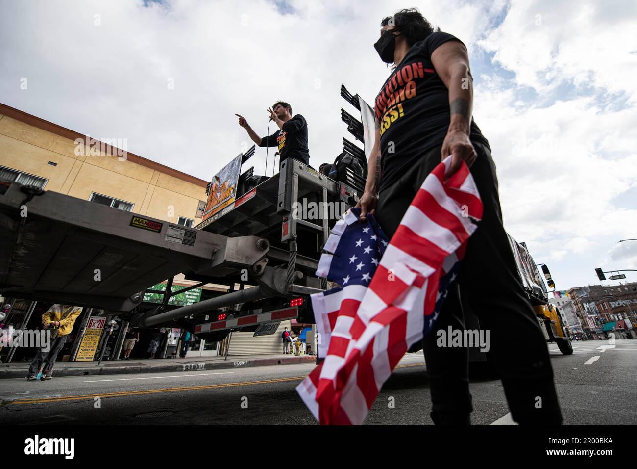 A protester speaks through a microphone to the masses as they march the ...