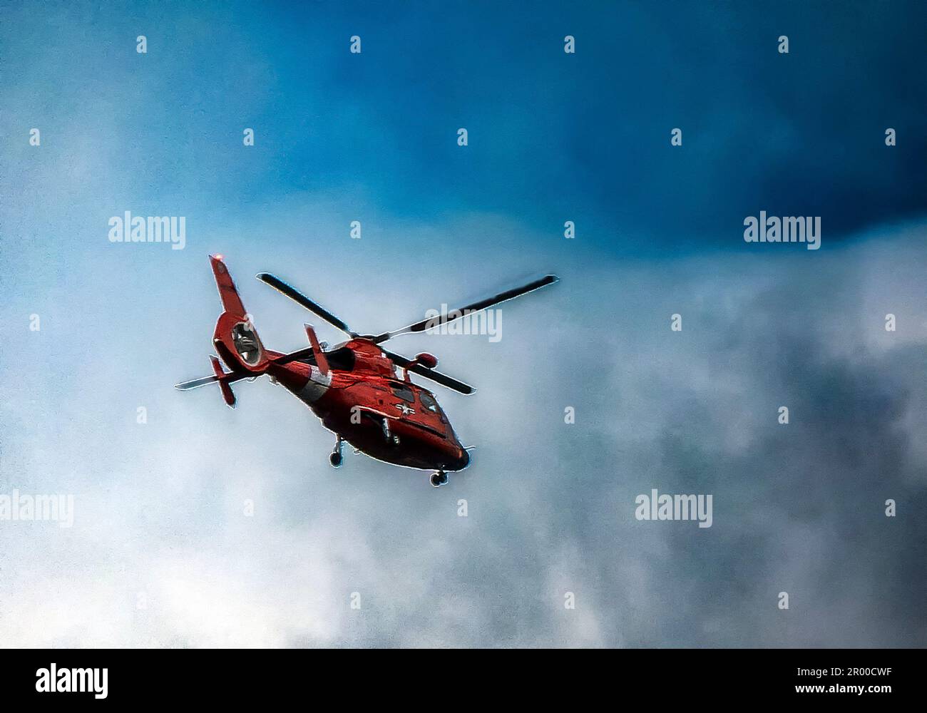 A Helicopter passes overhead Stock Photo - Alamy