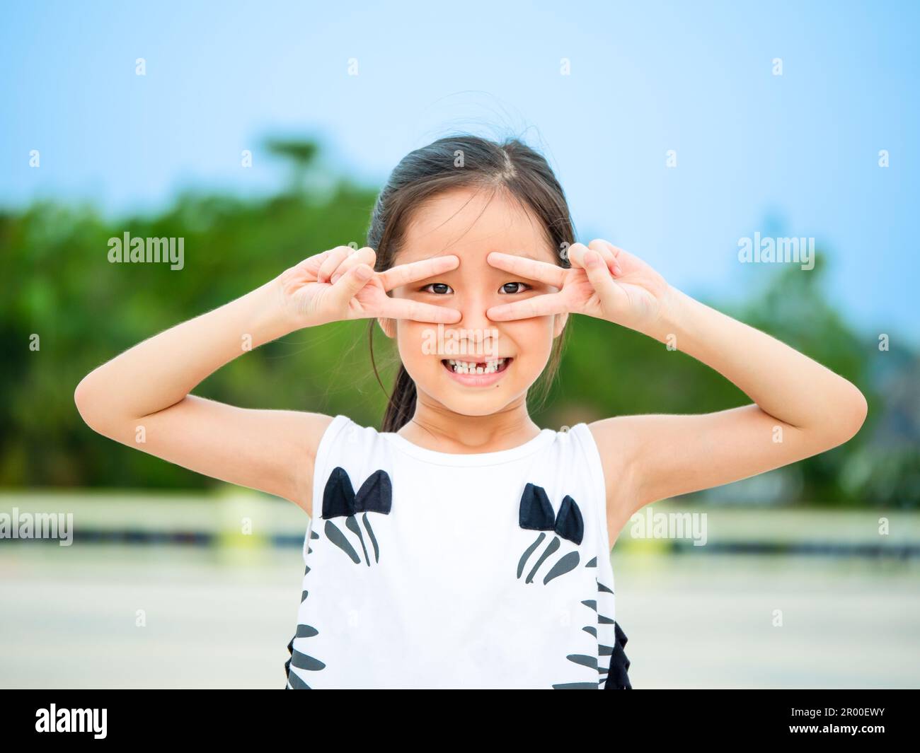 asian child cute or kid girl smiling eyes white teeth and one broken ...