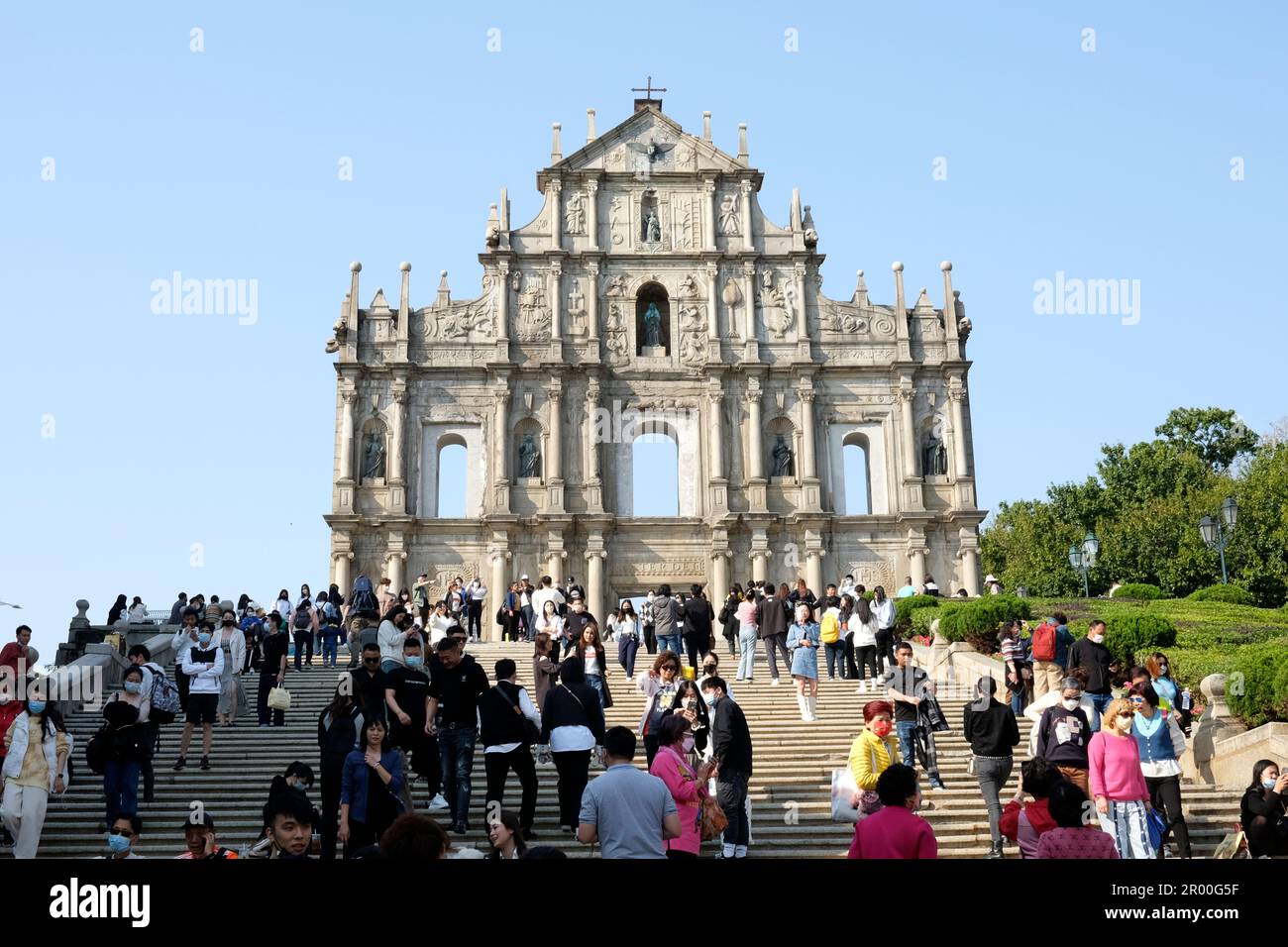 Tourists on the steps of the ruins of St Paul taking photos and selfies ...
