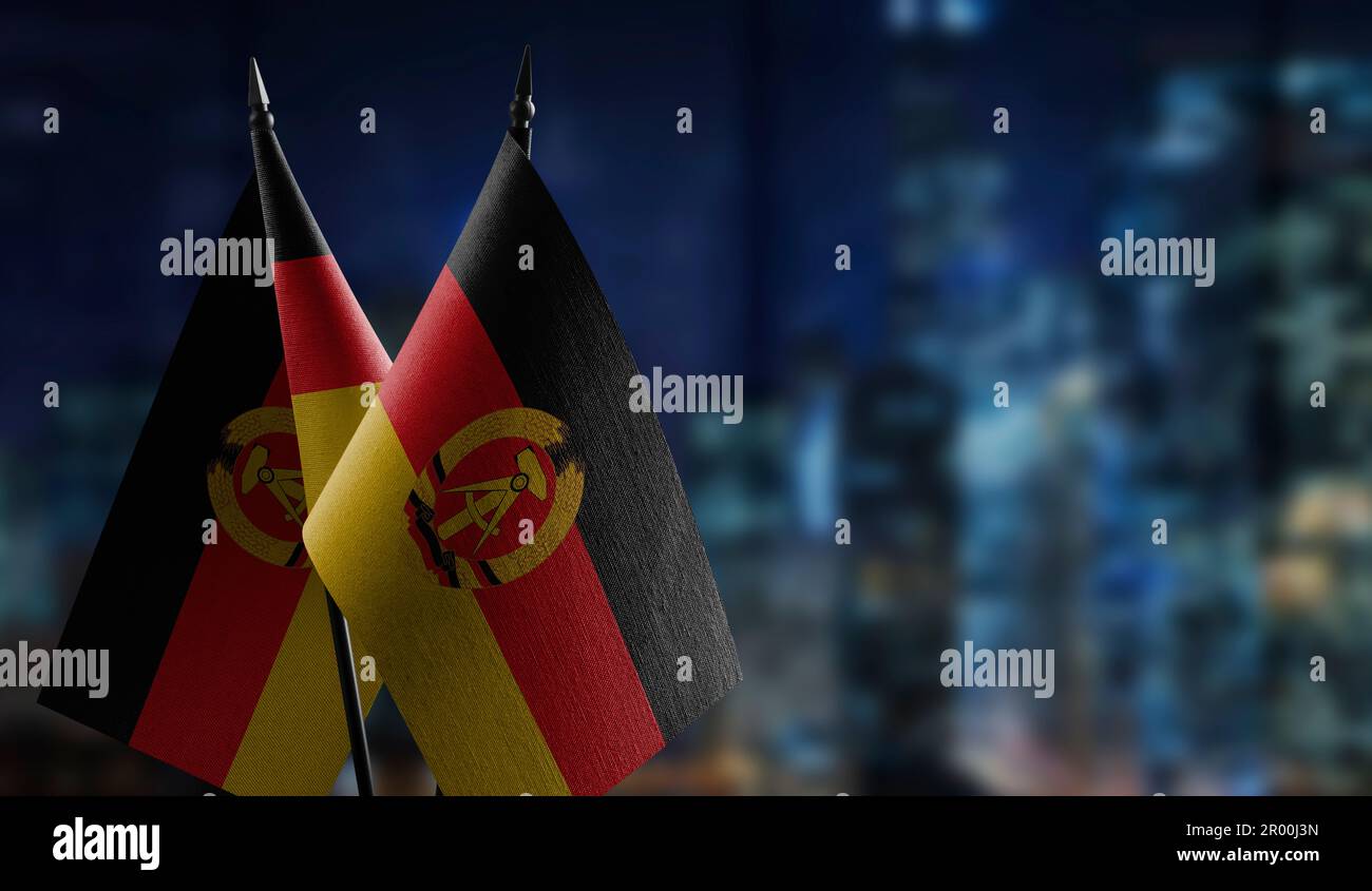 Small flags of the GDR on an abstract blurry background Stock Photo - Alamy