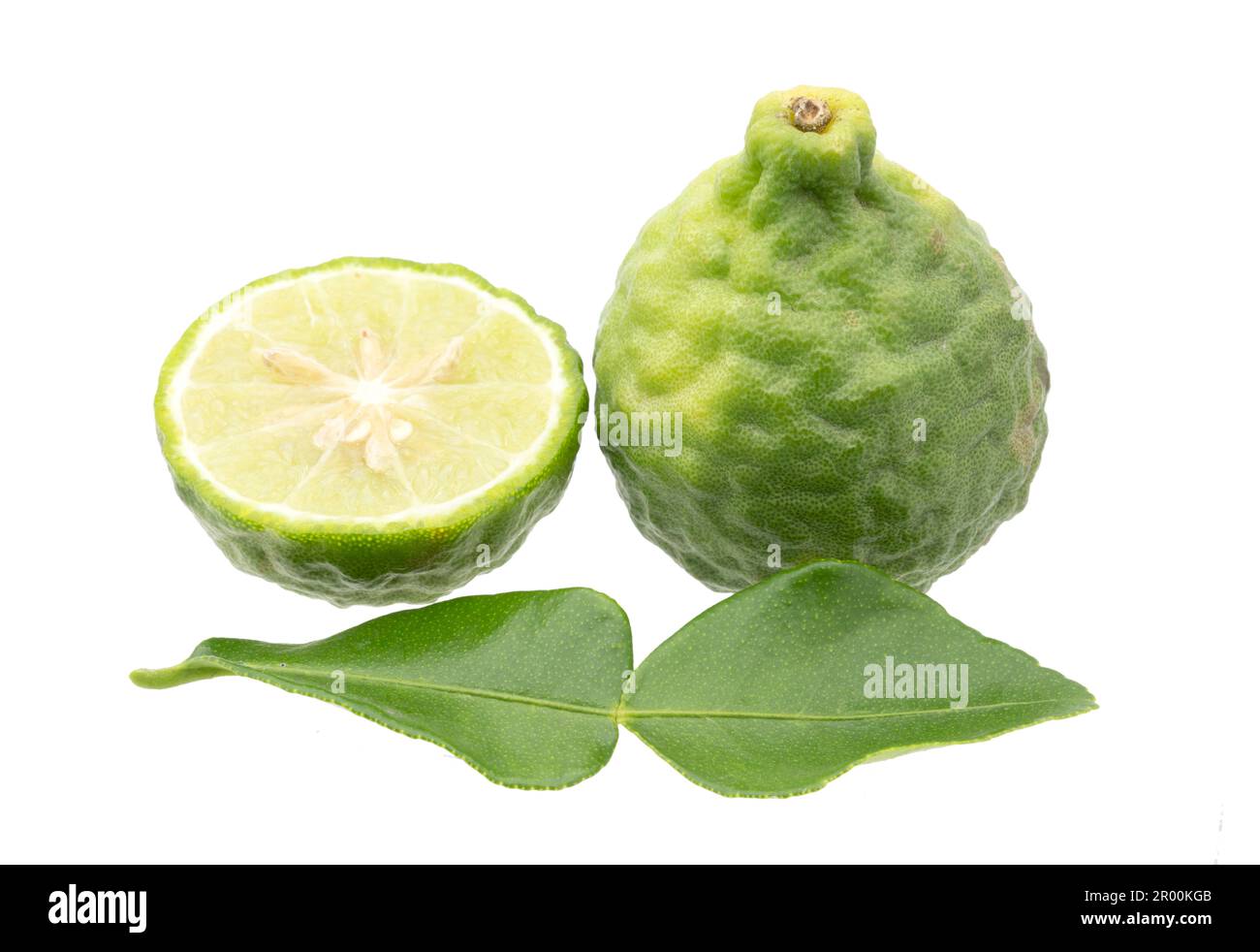 Fresh bergamot with cut in half isolated and grren leaf on white ...