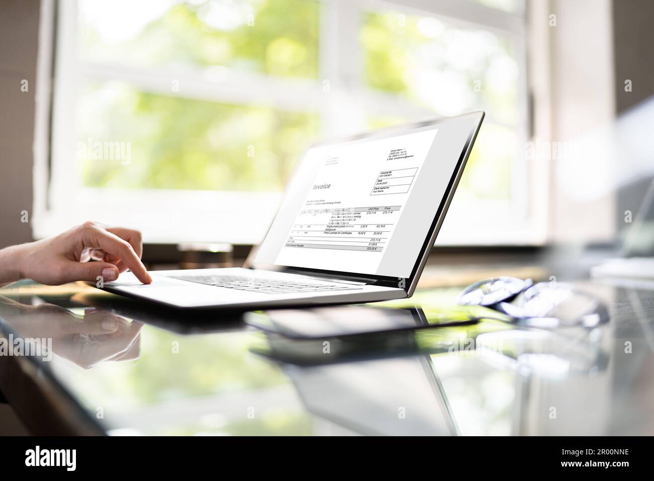 Accountant Calculating Electronic Invoice Or E Bill At Desk Stock Photo ...