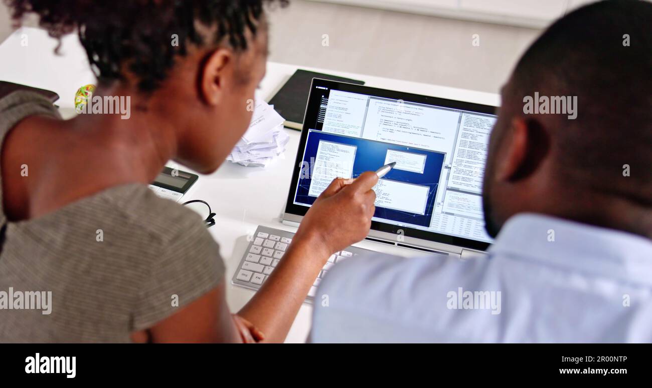 African American Coder Using Computer At Desk. Web Developer Stock ...