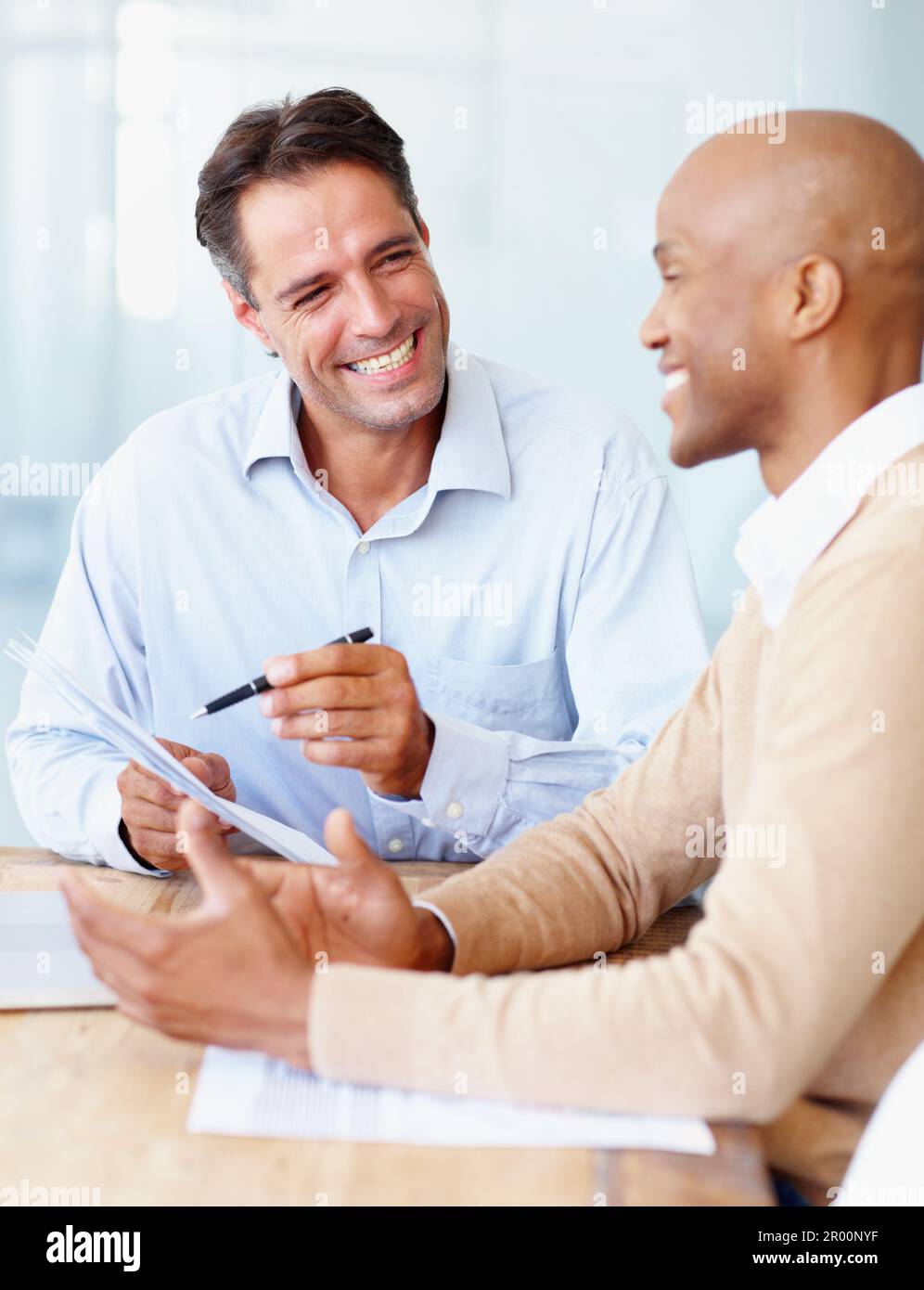 Meeting, happy business men with papers and talking or negotiating in ...