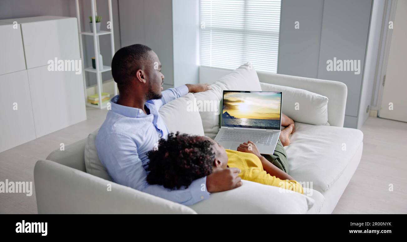 African Family Watching TV Movie On Laptop Stock Photo - Alamy