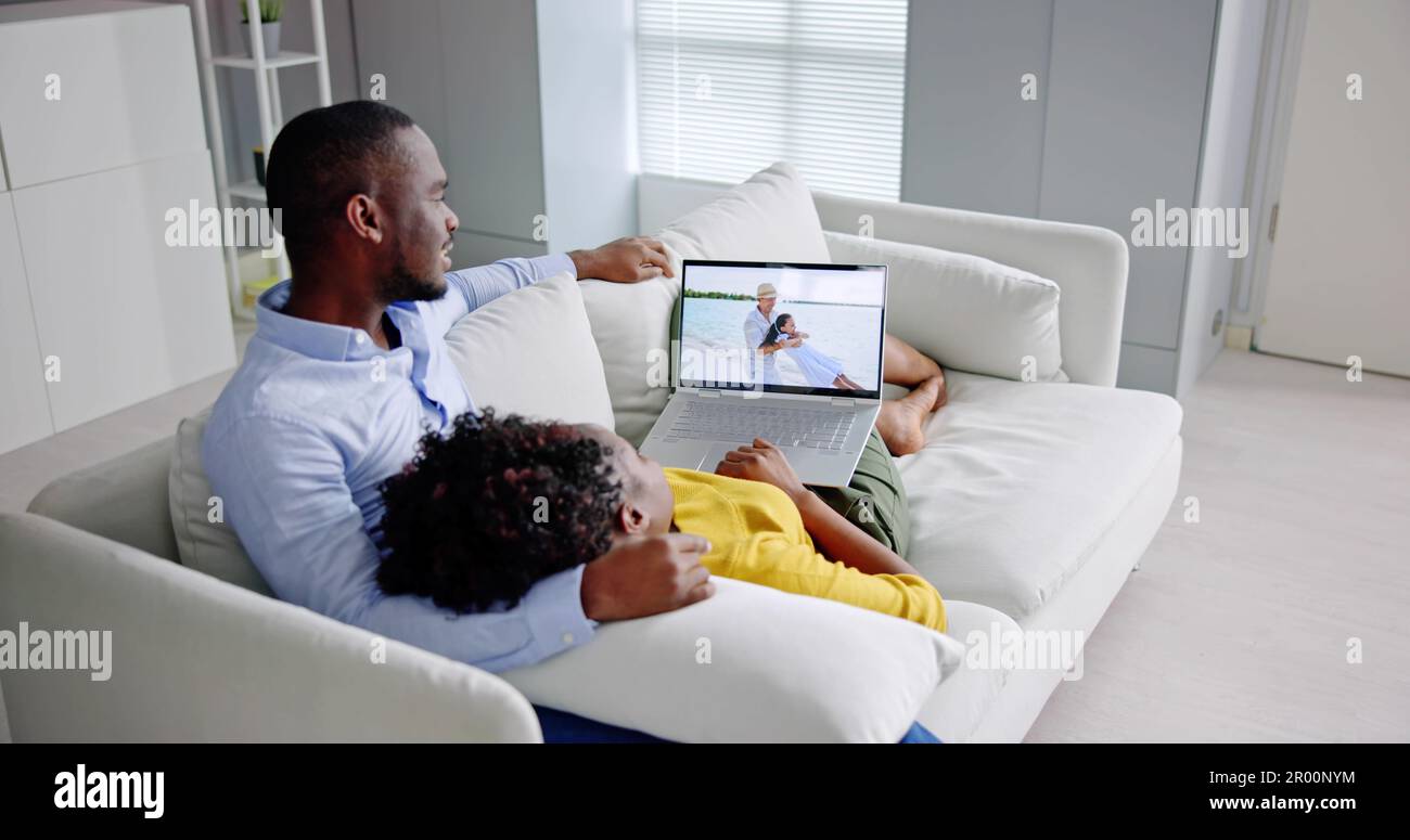 African Family Watching TV Movie On Laptop Stock Photo - Alamy