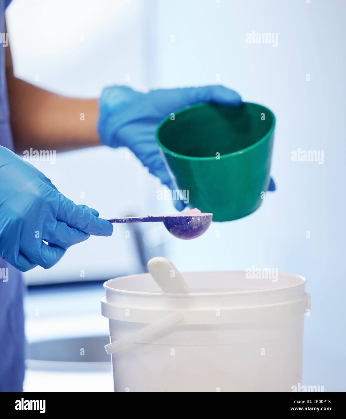 Dental impression prep. an unrecognisable dentist preparing plaster to ...