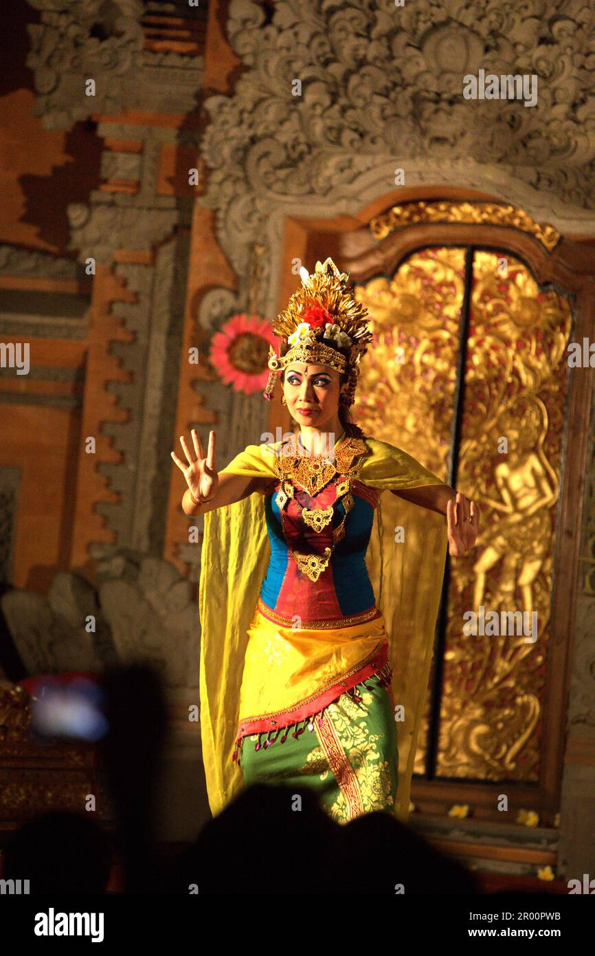 A performer during traditional Balinese legong and barong dance show at ...