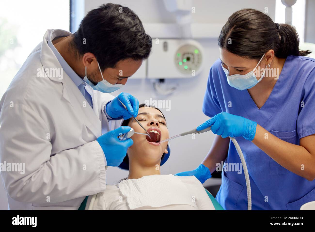 Getting right down to the root cause. a young woman having a dental ...