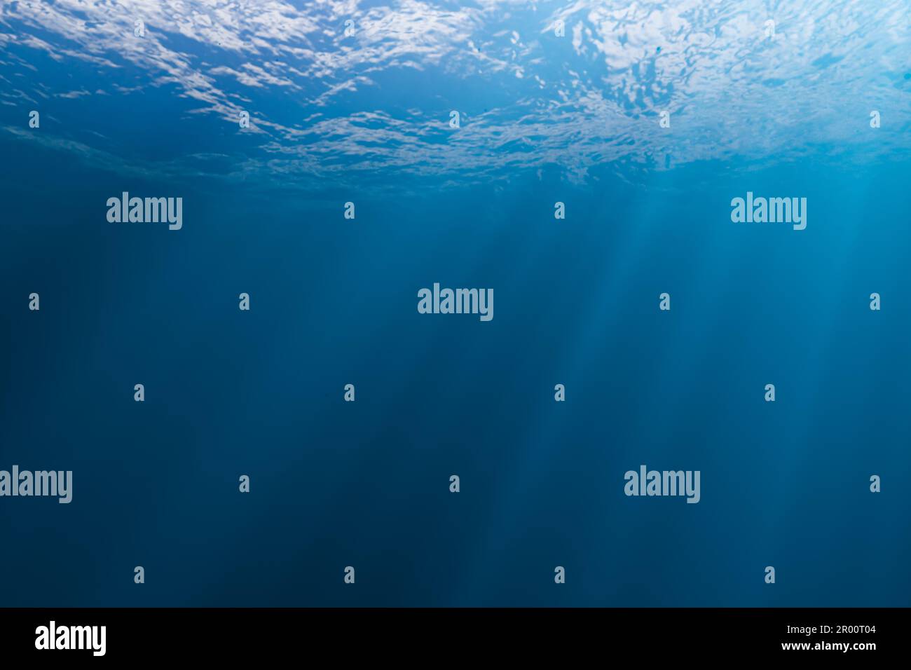 Underwater background with water bubbles and undersea light rays shine ...