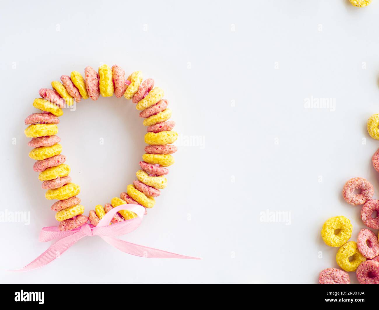Bracelet made with froot ring shaped cereal for Mothers day Stock Photo ...