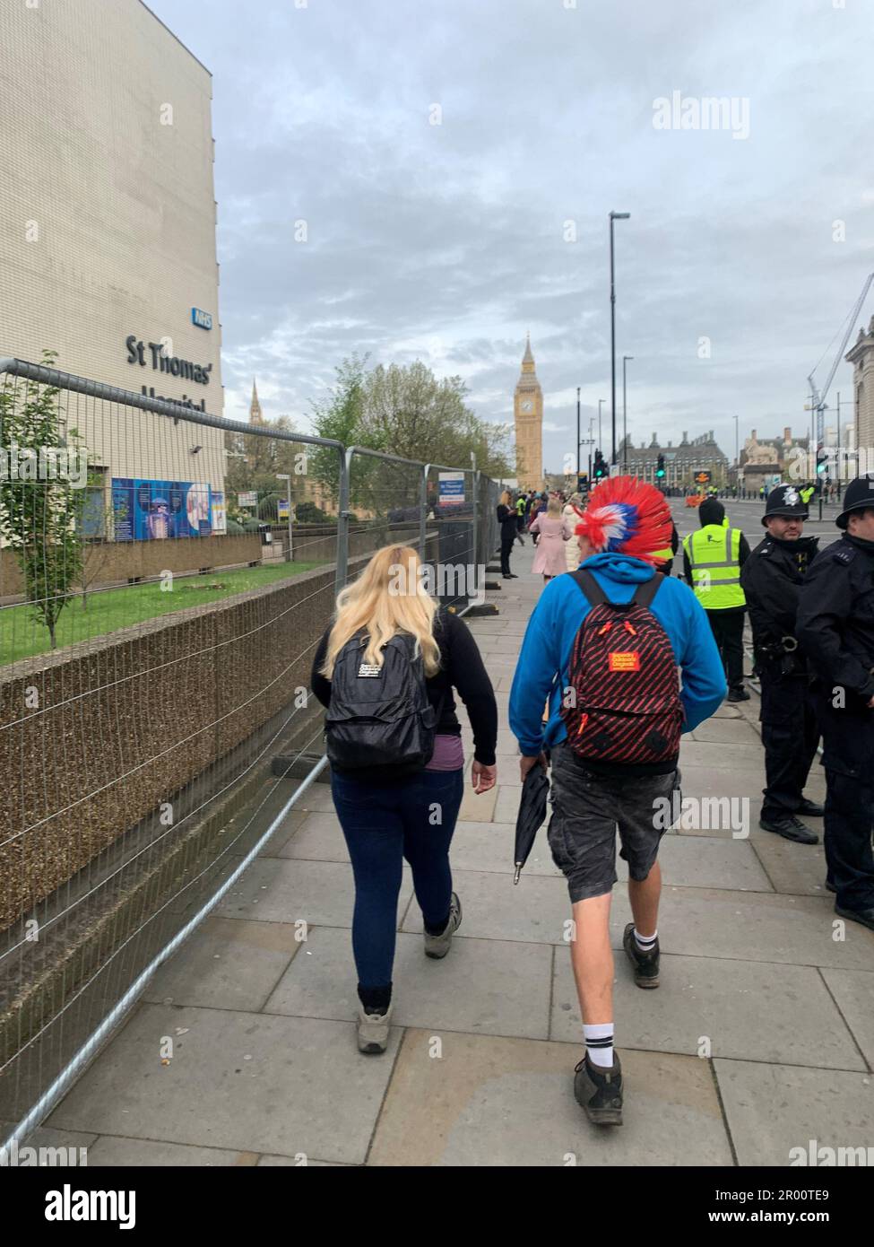 People make their way over Westminster Bridge to join the crowds ...