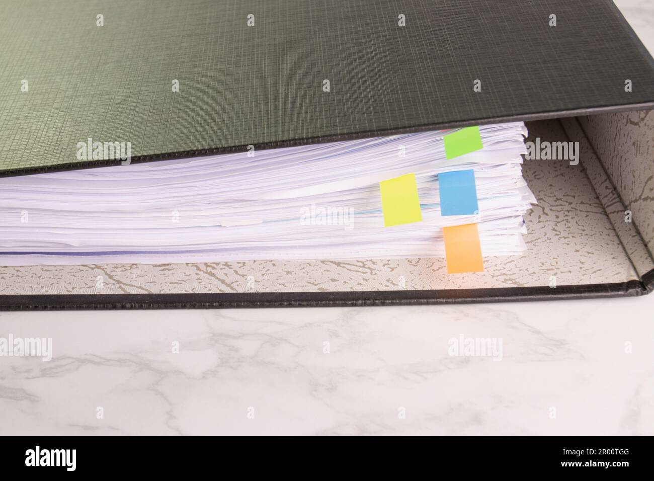 white paper stack in folder file for a business contract, income ...