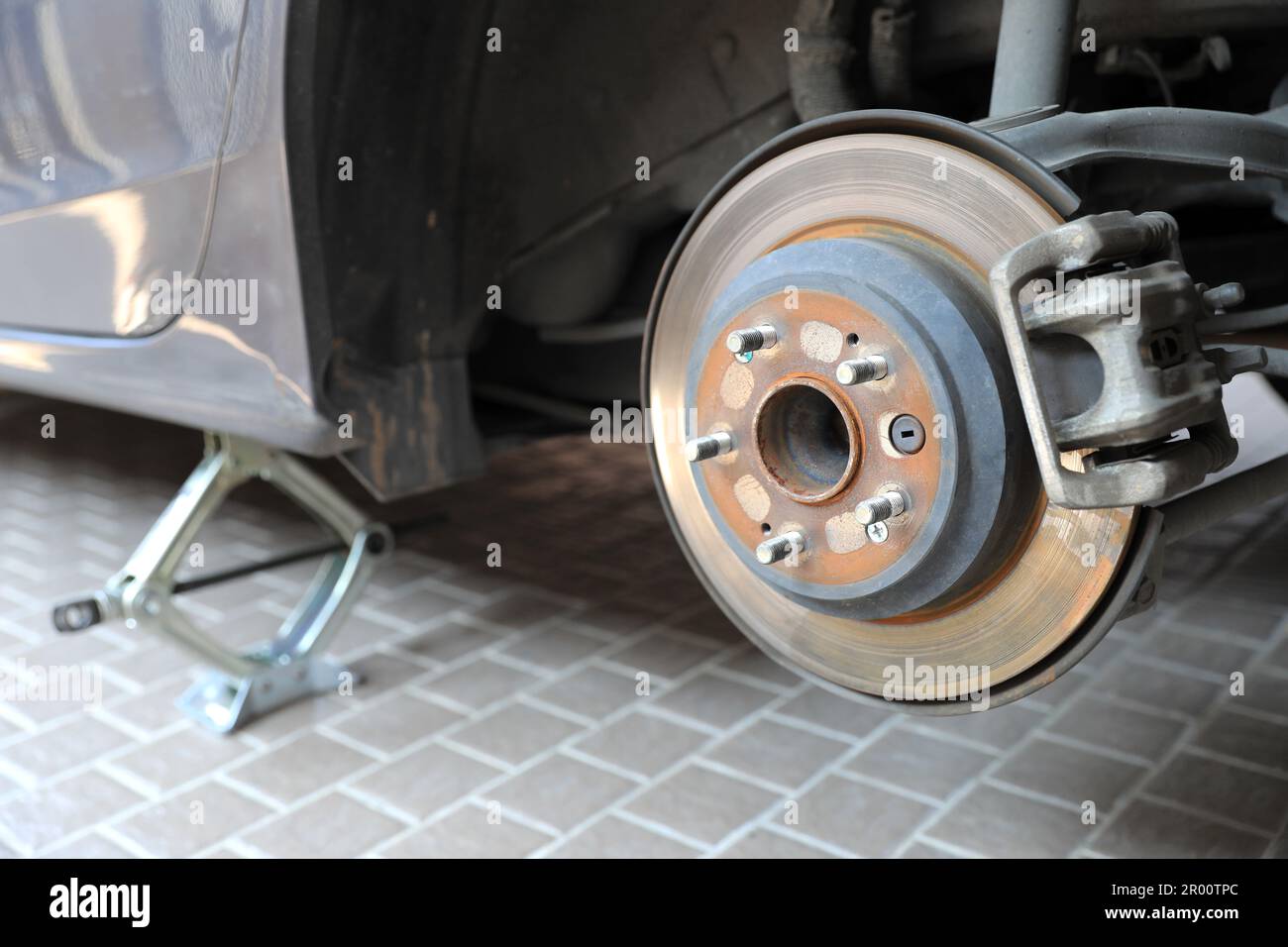 Disk brake and caliper in process of new tire replacement Stock Photo ...