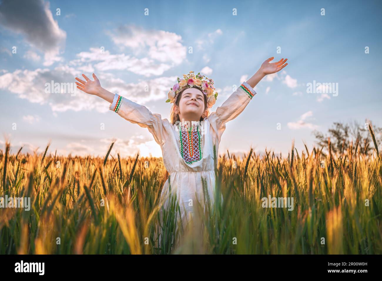 Beautiful young girl with flower chaplet, ethnic folklore dress with ...