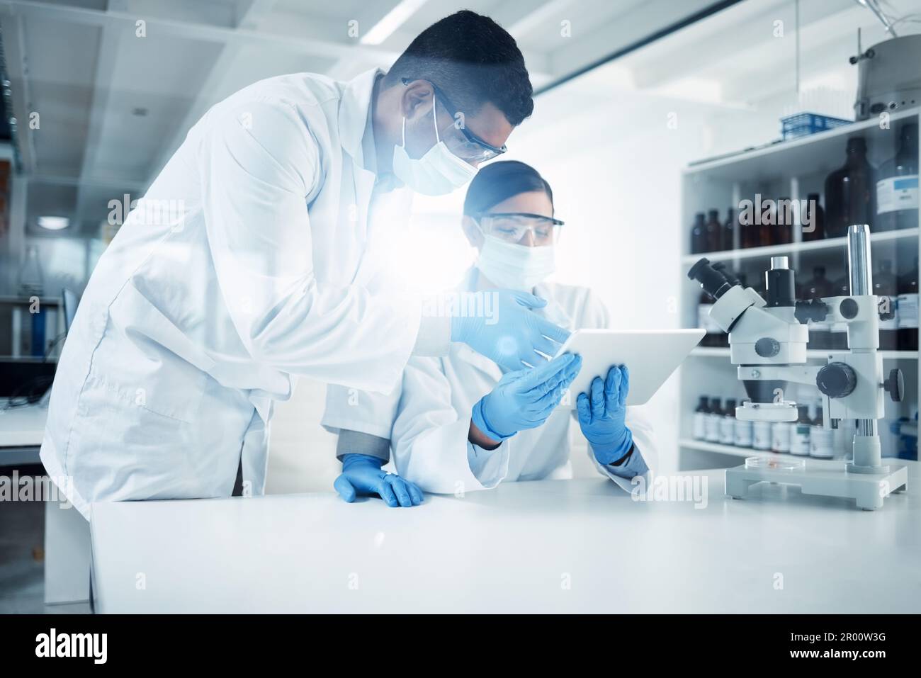 Real solutions for real life issues. two young scientists using a ...