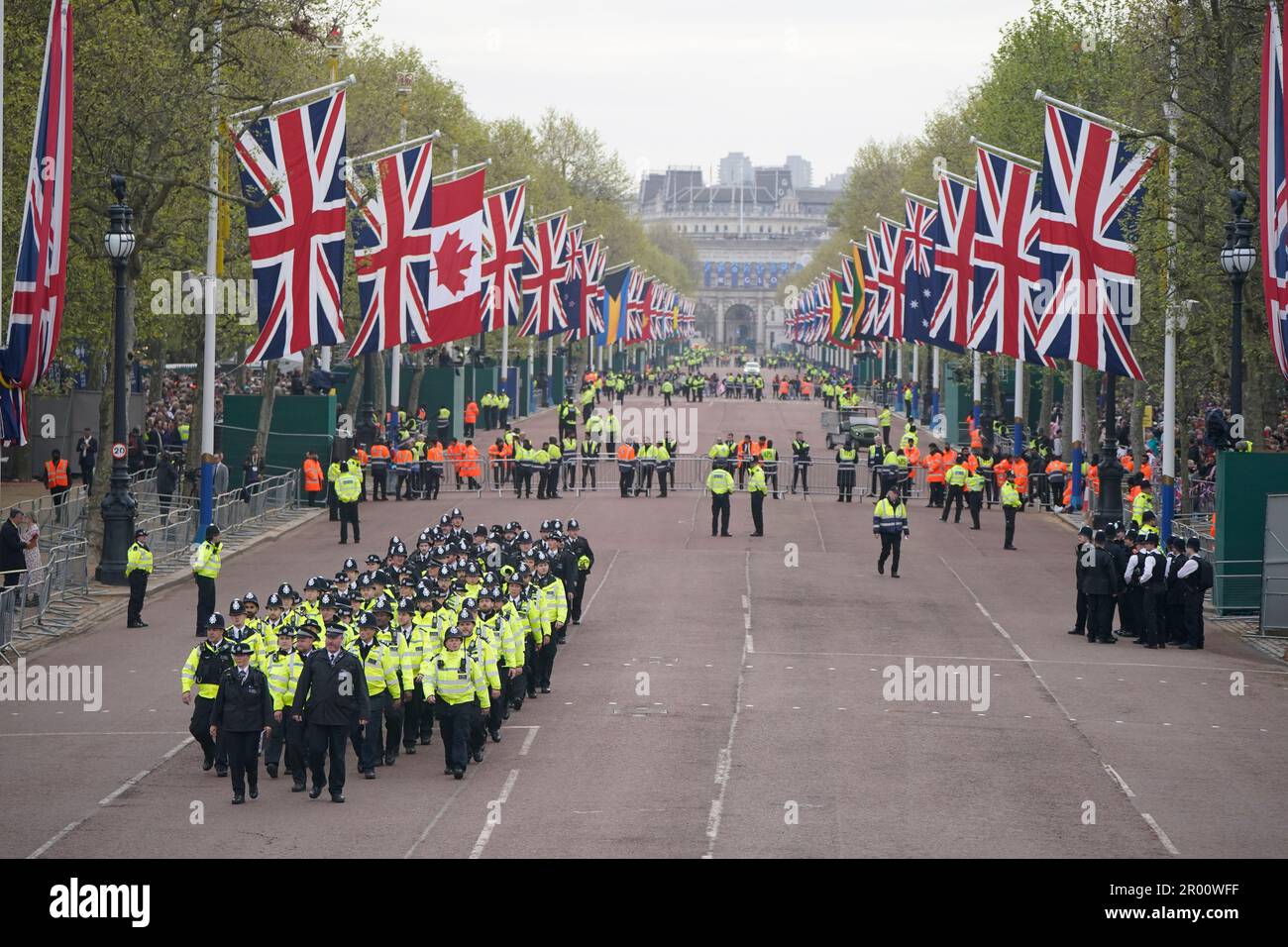 Metropolitan Police officers march along The Mall in London as they ...