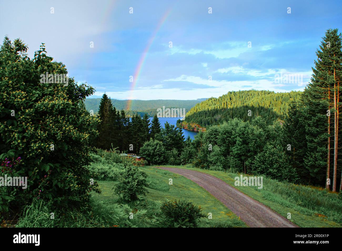 Rainbow Over Lake - A Fairy Tale Scene in Norway Stock Photo - Alamy