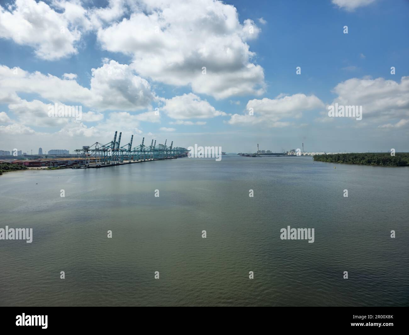 Cargo container terminal in deep sea port at industrial estate with ...