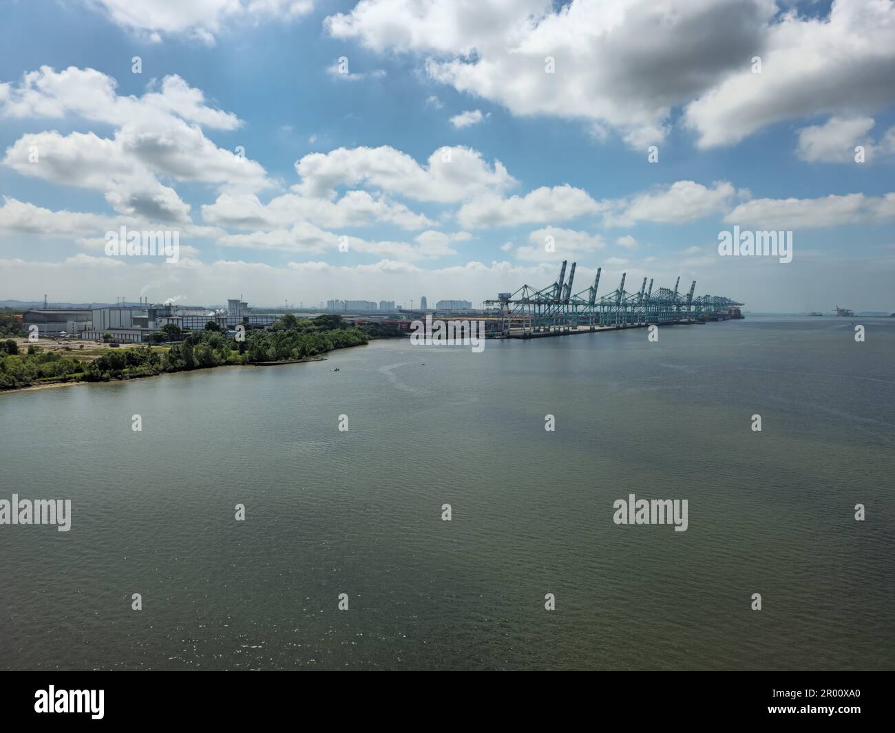 Cargo container terminal in deep sea port at industrial estate with ...