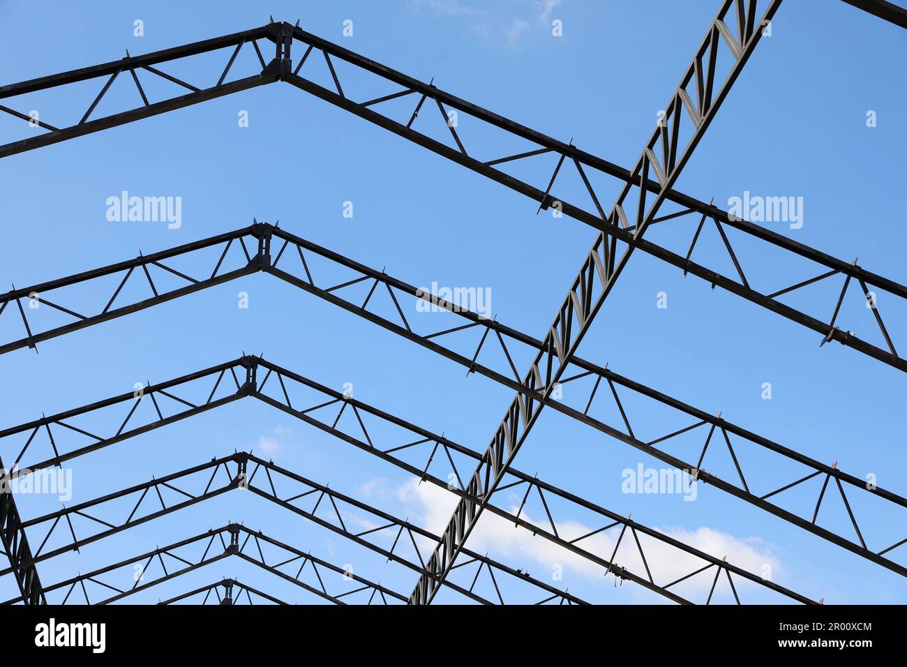 Steel structure with blue sky background Stock Photo - Alamy