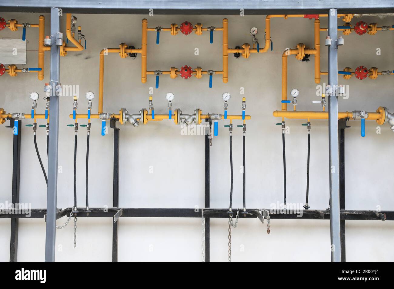 Yellow gas pipeline system installed on building wall Stock Photo - Alamy