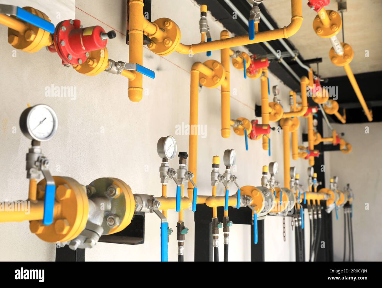 Yellow gas pipeline system installed on building wall Stock Photo - Alamy