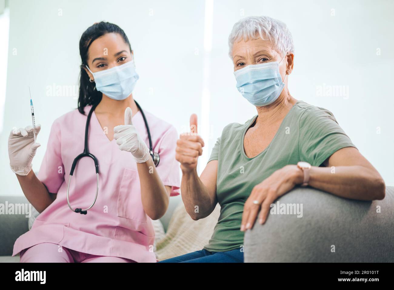 More than a doctor...Portrait of a masked doctor and her masked patient ...