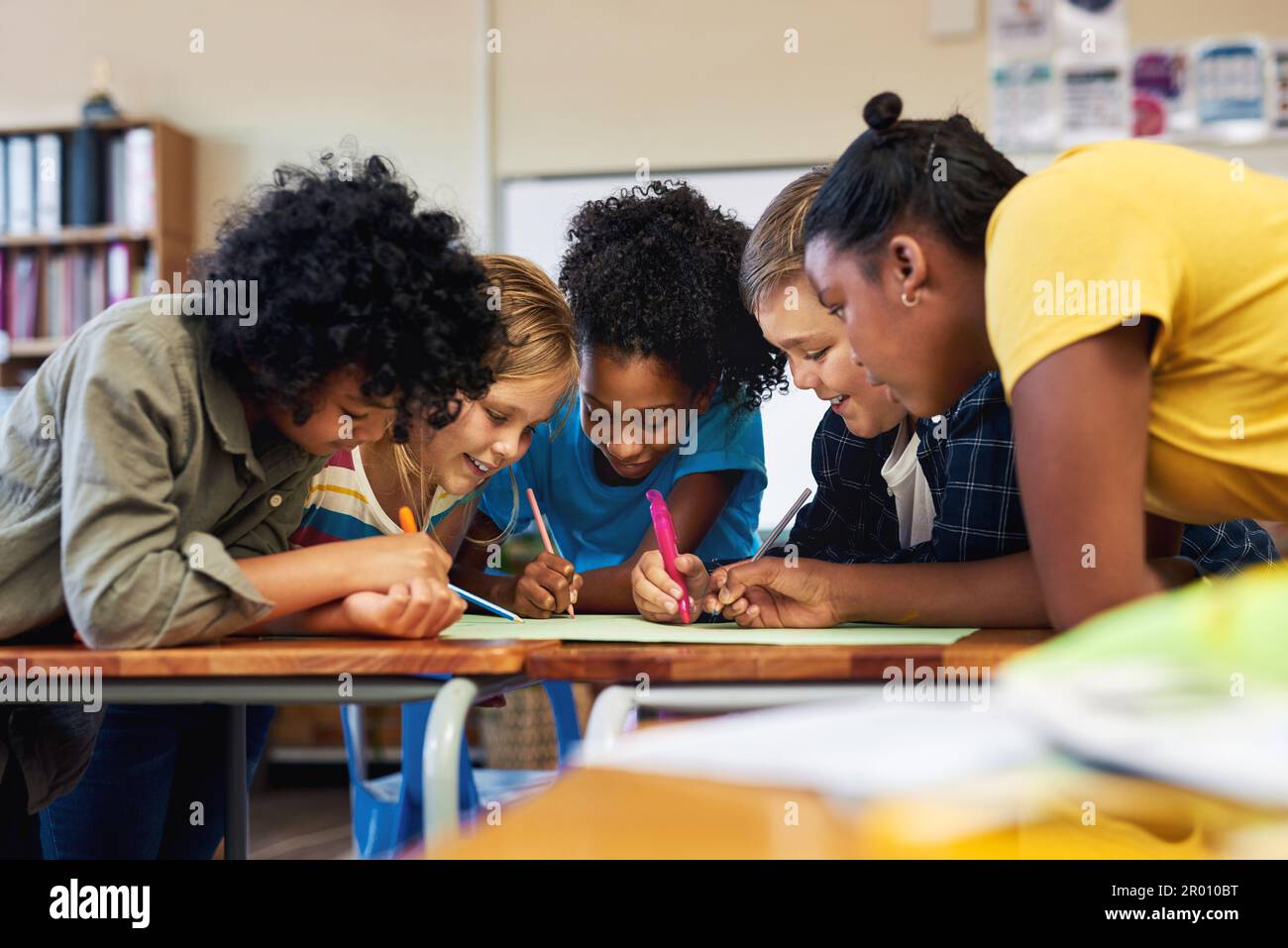 Teaching team skills at an early age. a diverse group of children ...