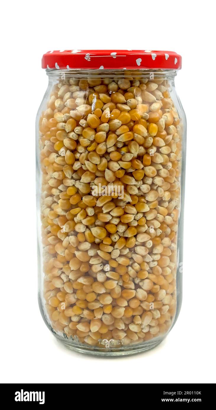 Corn kernels in jar isolated on white background. Dry yellow corns ...