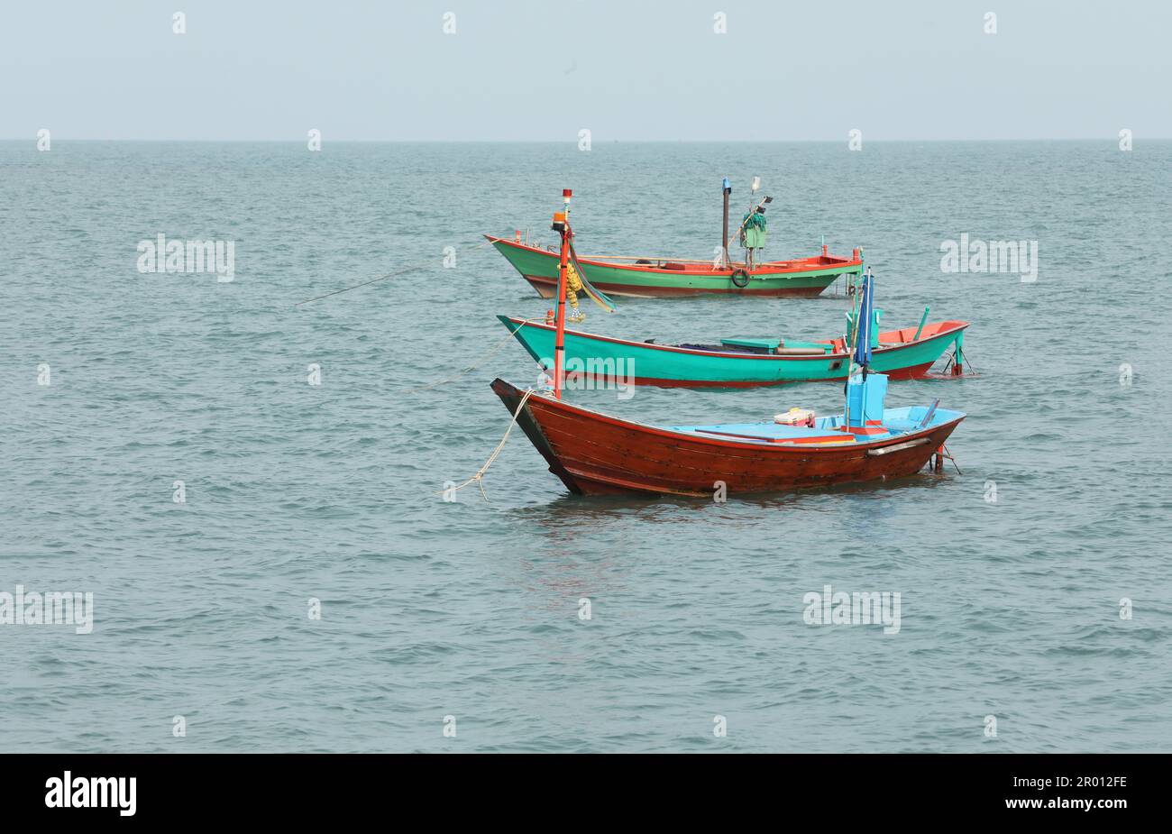 Group of fishing boat floating on the sea Stock Photo - Alamy