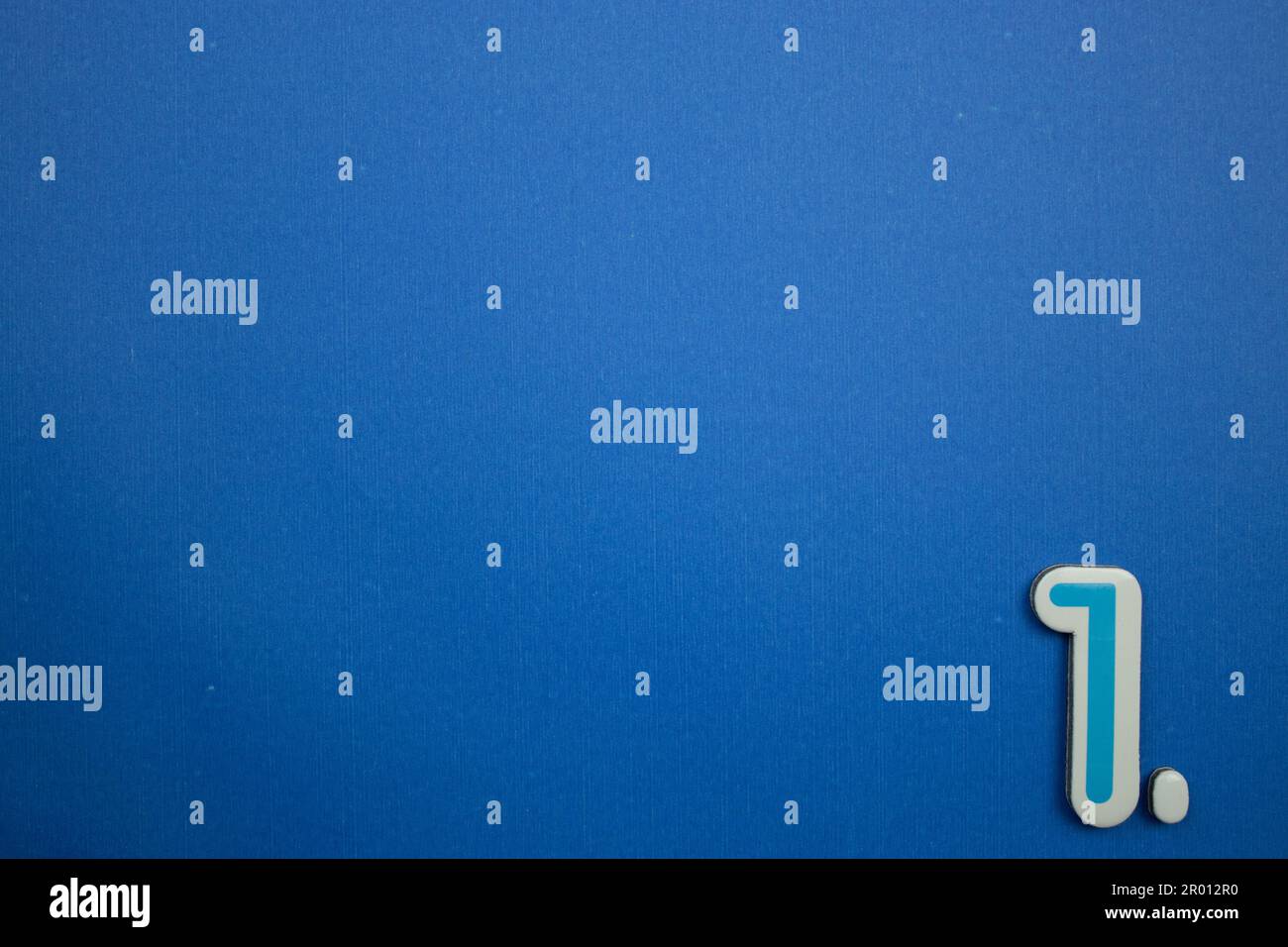 The number 1 in light blue and white color, photographed from above ...