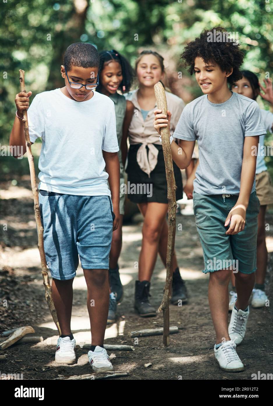 Camp time is adventure time. a group of teenagers exploring nature ...