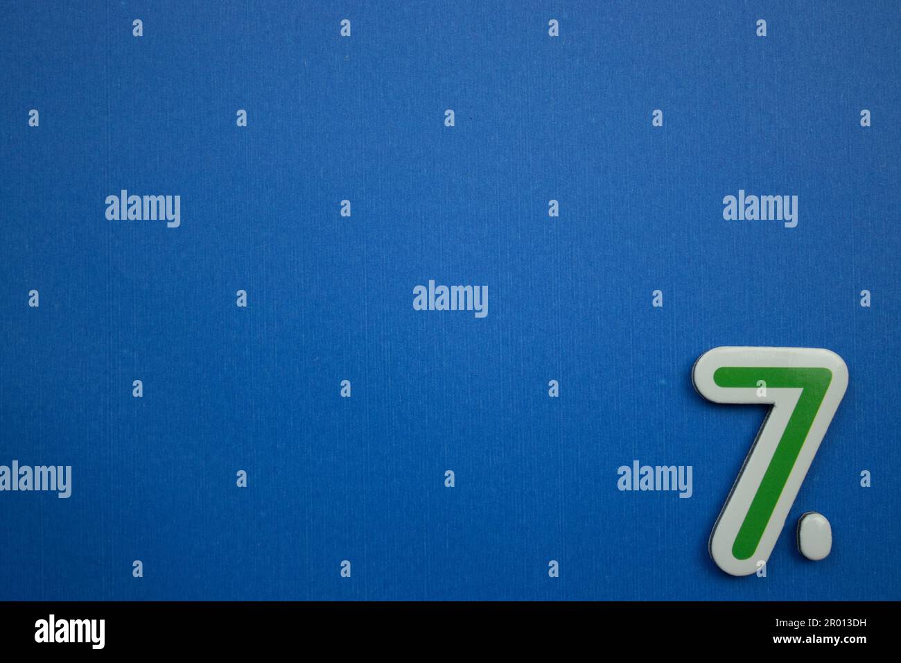 The number 7, green and white, photographed from above, placed on the ...