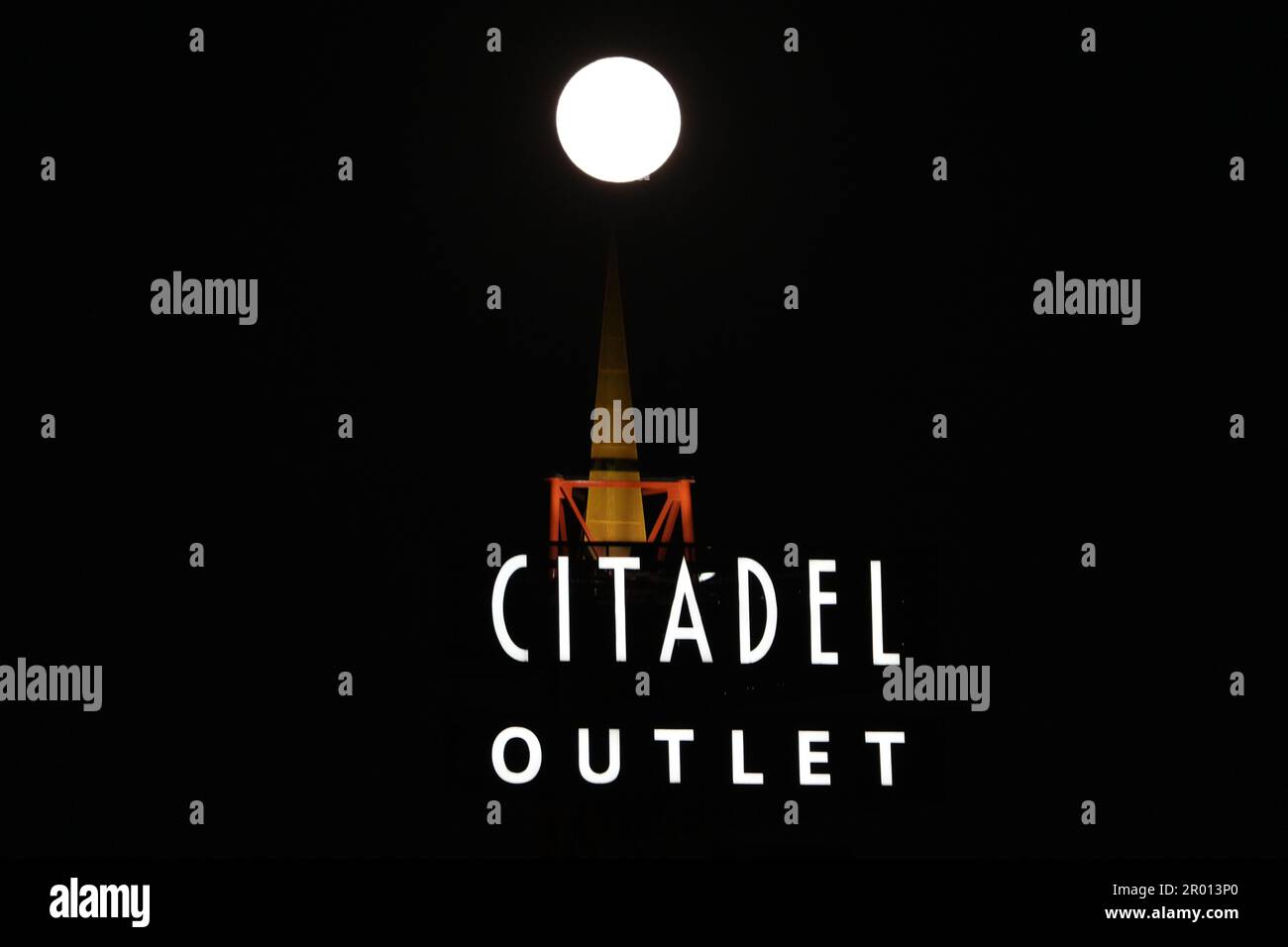 A full moon rises over citadel outlets shopping mall hi-res stock ...