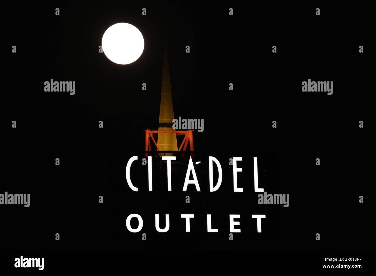 A full moon rises over citadel outlets shopping mall hi-res stock ...