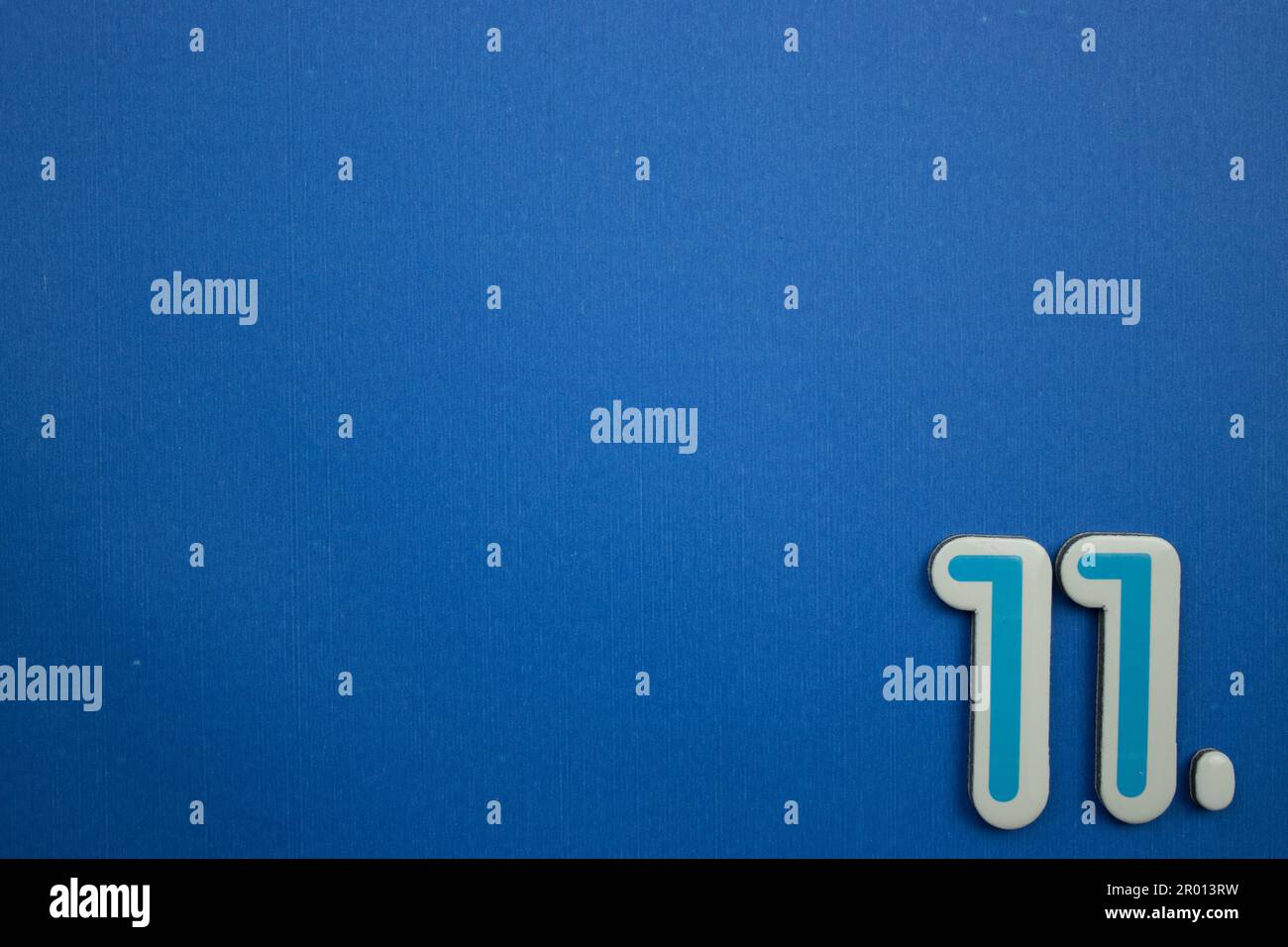 The number 11 in light blue and white color, photographed from above ...