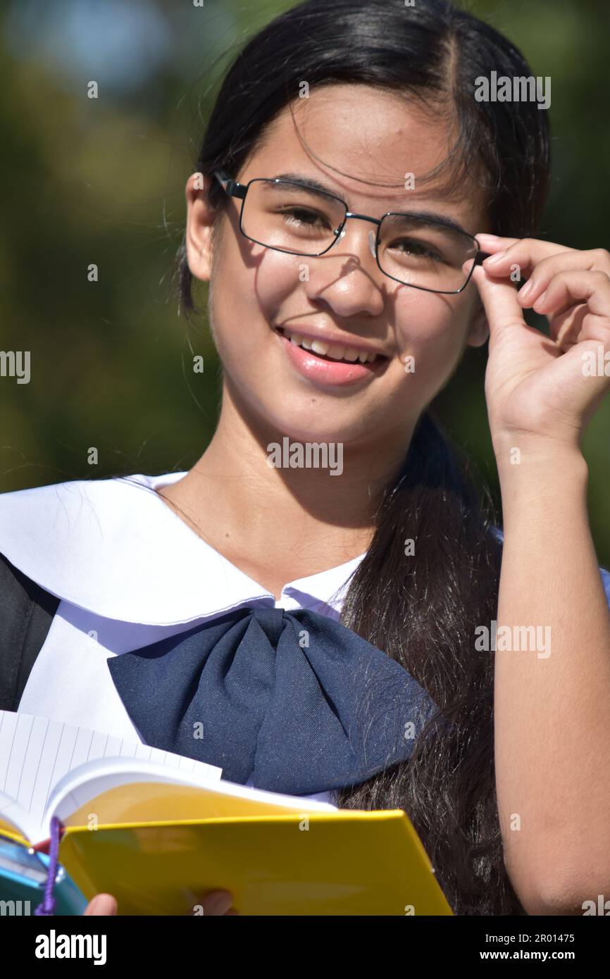 Filipina Female Student Smiling With Notebooks Stock Photo - Alamy