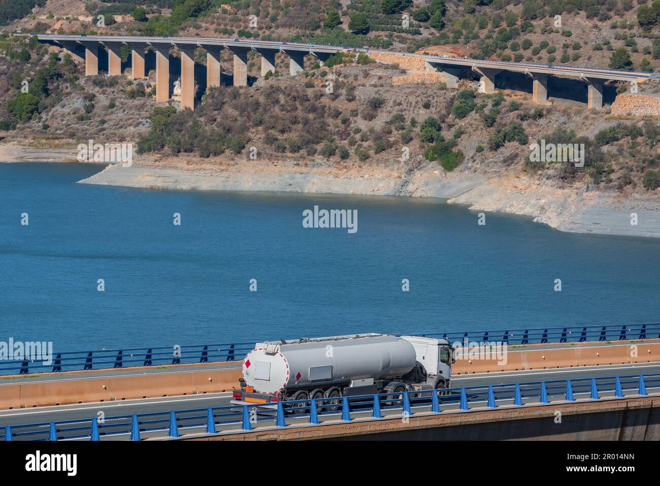 Tanker truck for the transport of fuels circulating on a bridge, in the ...