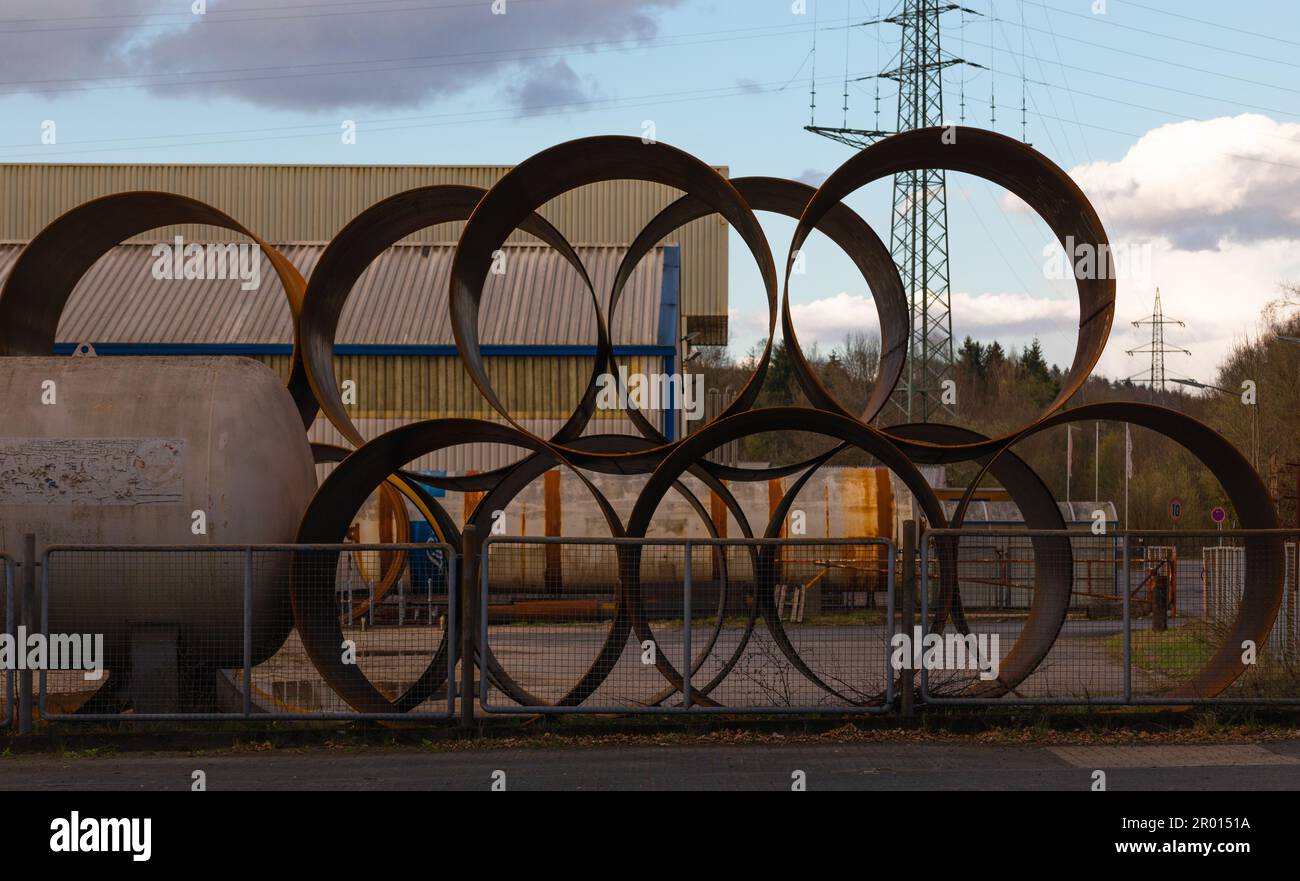Rusty metal tubes stacked in a courtyard Stock Photo - Alamy