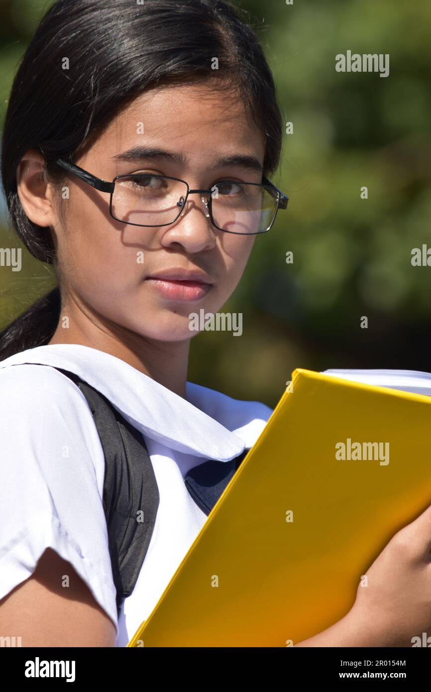 A Young Filipina Female Student Reading Stock Photo - Alamy