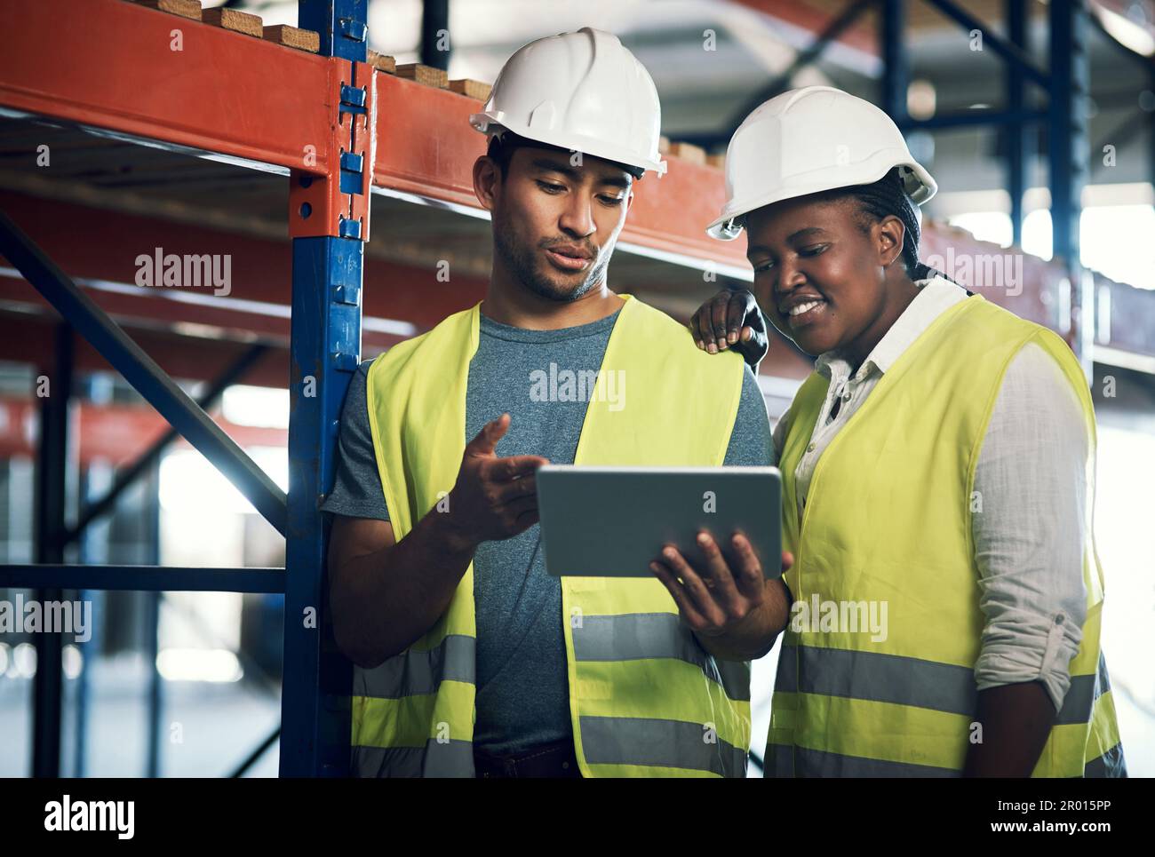 Smart planning makes for safe operations. two builders using a digital ...